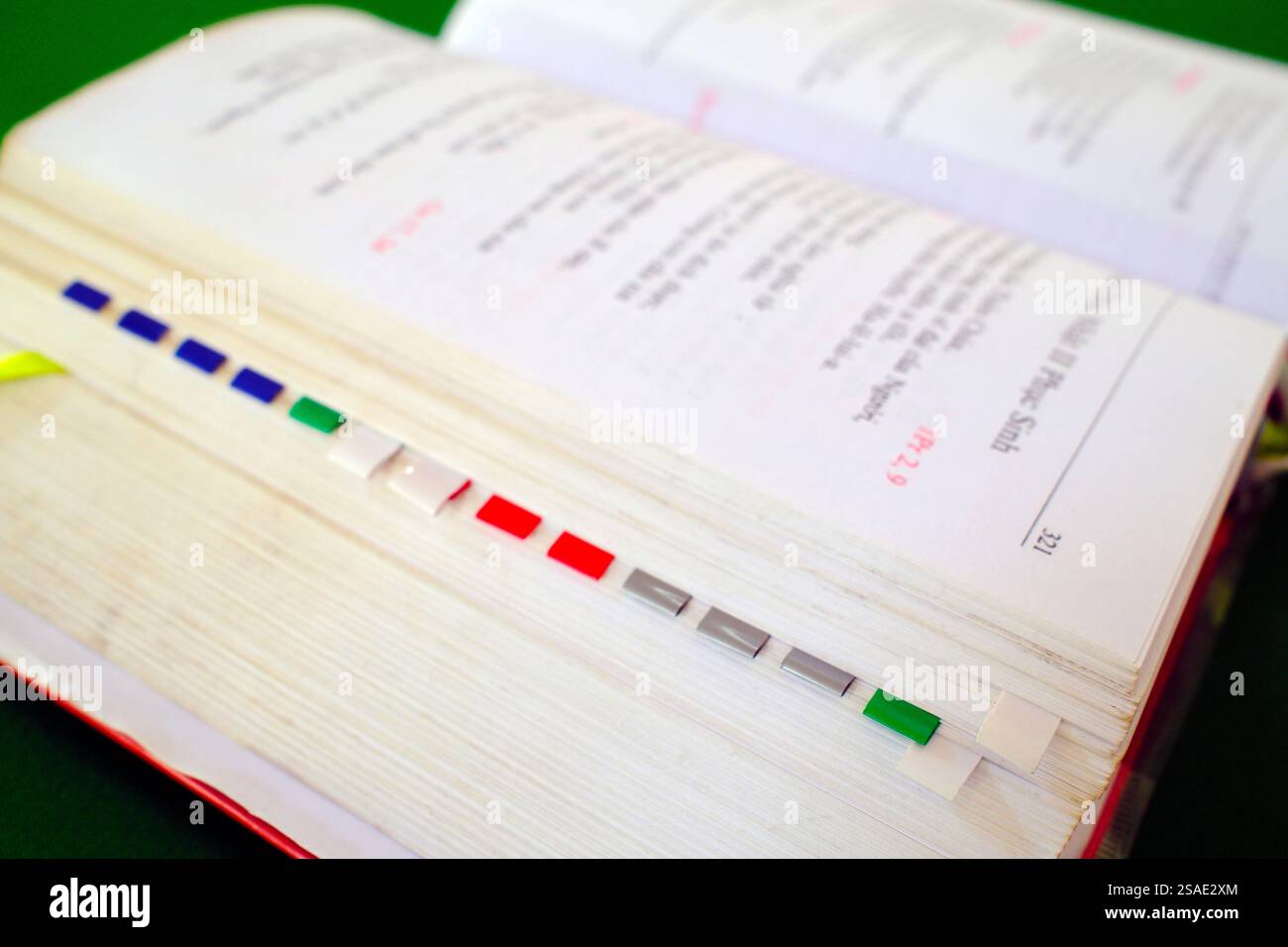 Open Bible with bookmarks on a church altar Stock Photo - Alamy