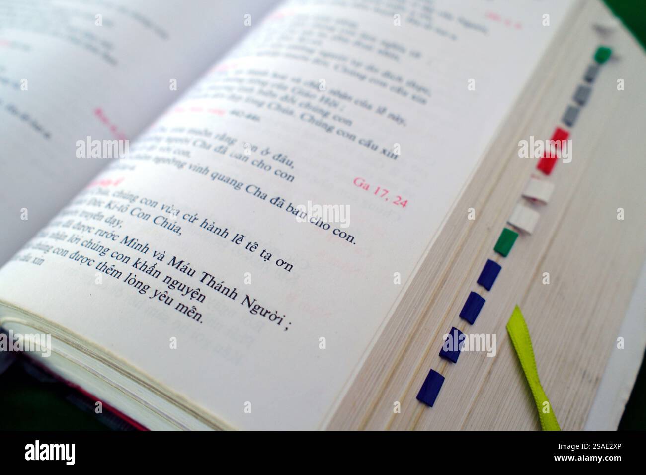 Open Bible with bookmarks on a church altar Stock Photo - Alamy