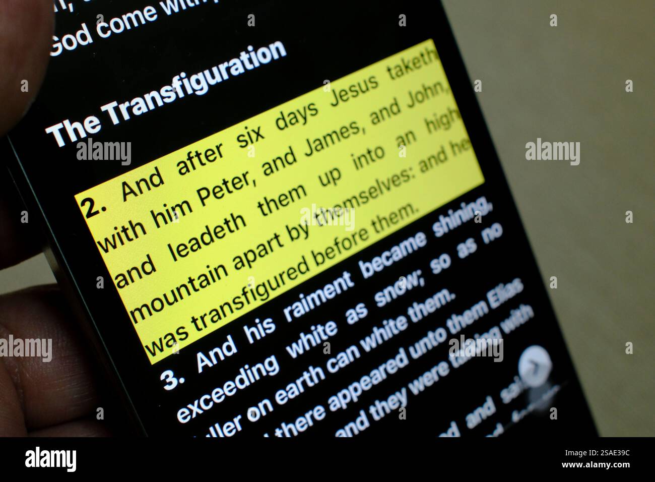 Technology. Digital bible app on a smartphone. The transfiguration. Tan ...