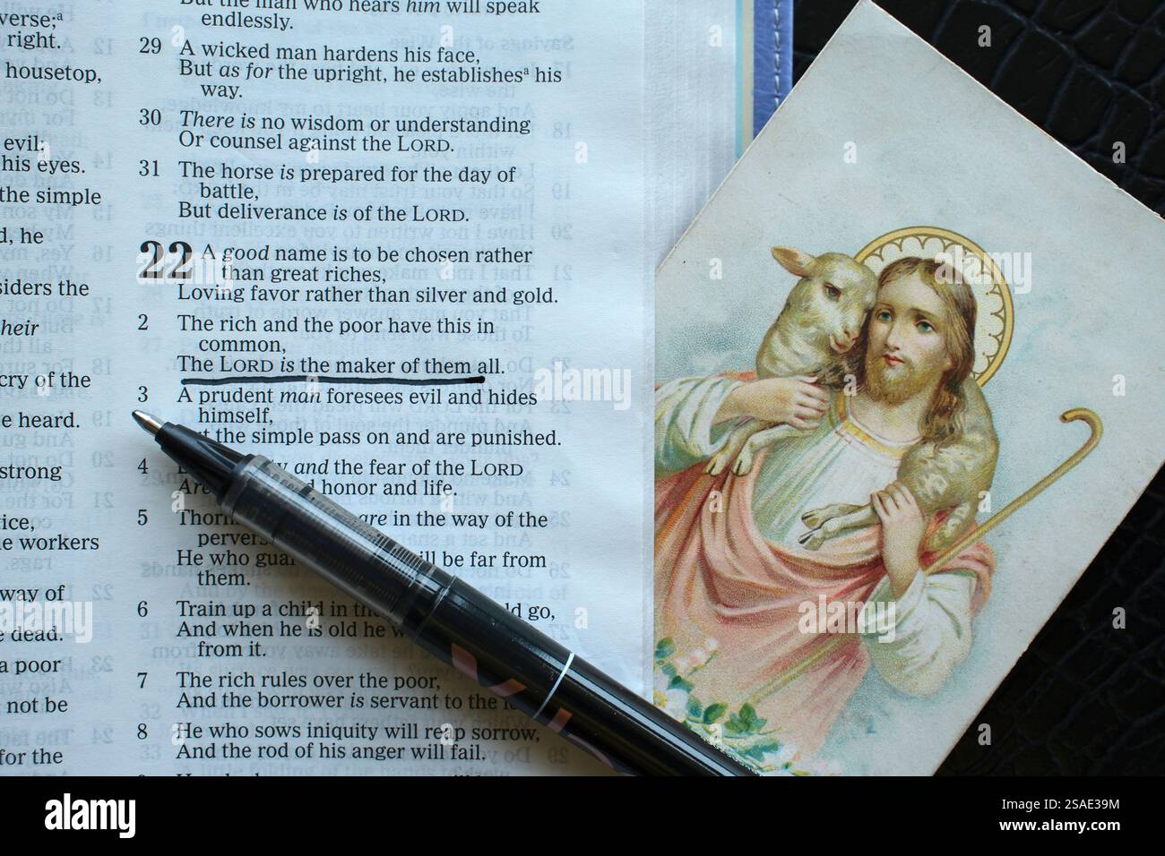 Open Bible with a religious image. Jesus the good shepherd. Study and ...