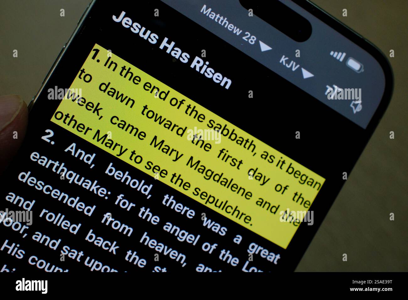 Technology. Digital bible app on a smartphone. Jesus has risen. Tan ...