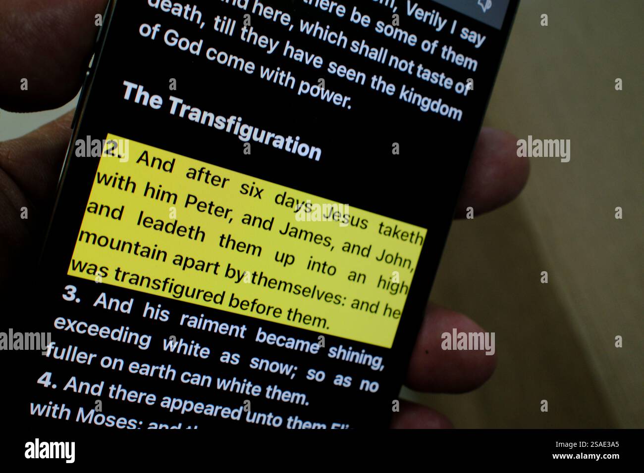 Technology. Digital bible app on a smartphone. The transfiguration. Tan ...