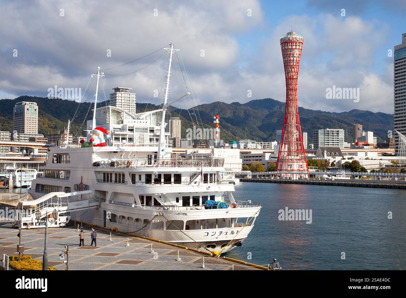The cruise ship Concerto moored at Kobe Harborland with Kobe Port Tower ...