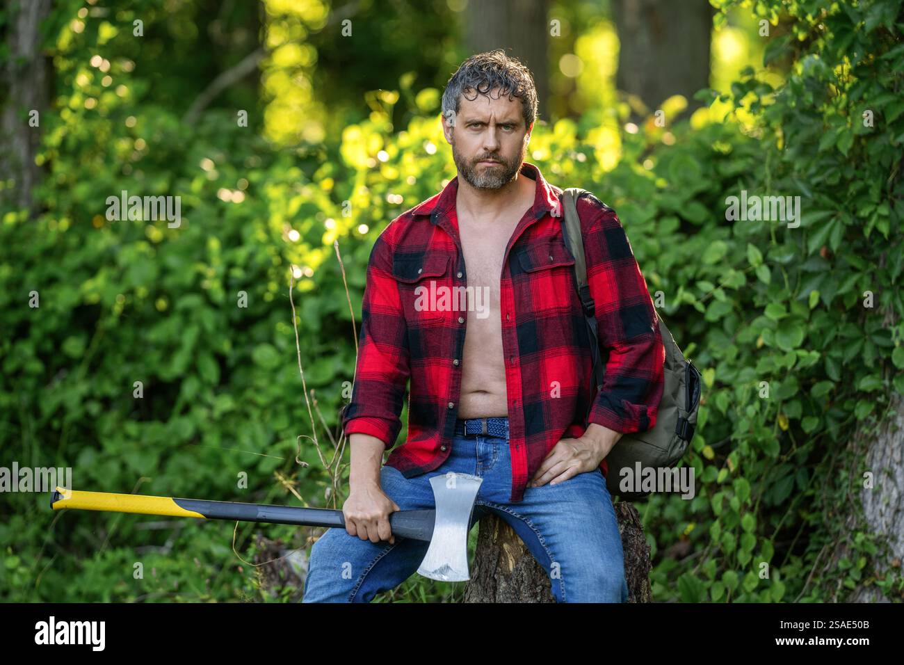 Logging lumberjack man outdoor. Brutal lumberjack. Brutality and ...