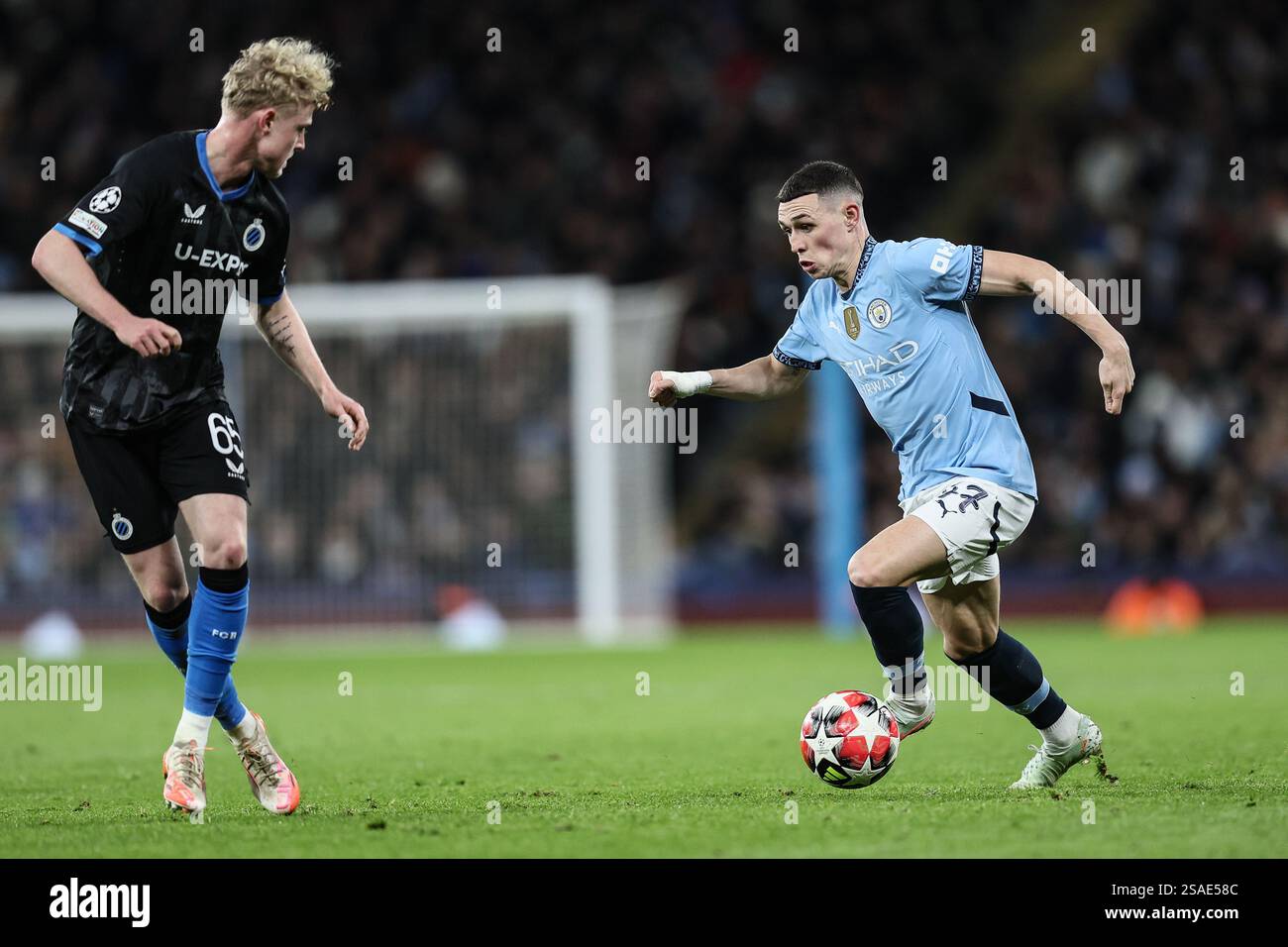 Club's Joaquin Seys and Manchester City's Phil Foden fight for the ball ...