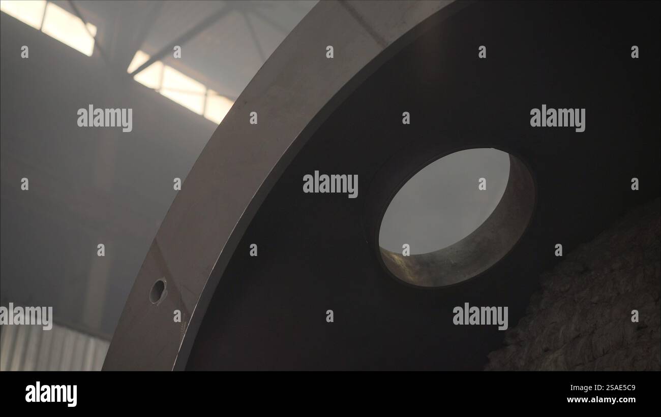 Close-up of a circular hole in a large metal component, possibly part ...