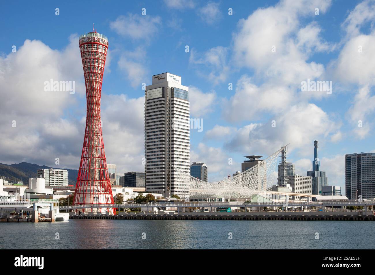 Kobe Harborland with the red Kobe Port Tower, Okura Hotel skyscraper ...