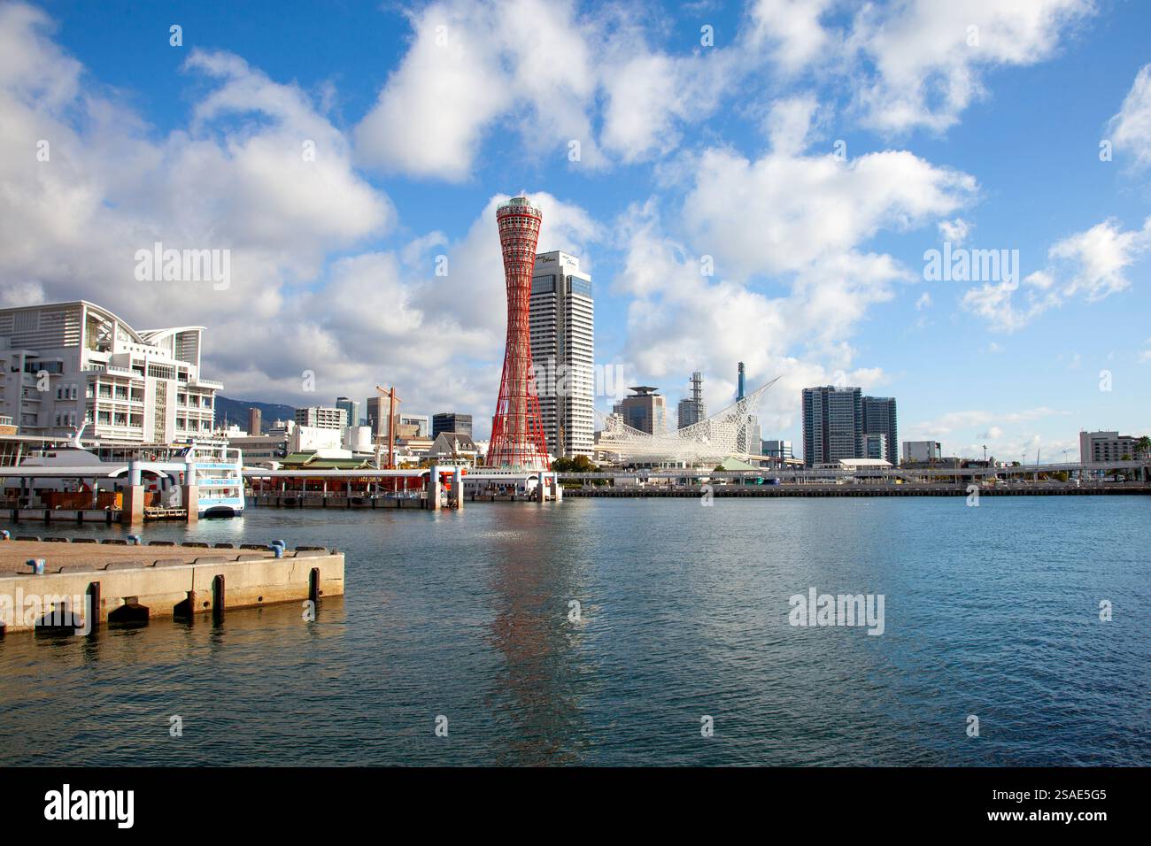 Kobe Harborland with the red Kobe Port Tower, Okura Hotel skyscraper ...
