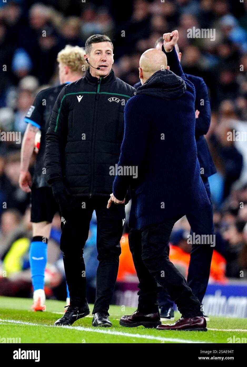 Manchester City manager Pep Guardiola (right) argues with the fourth ...