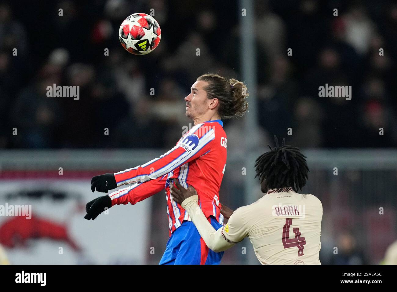 Atletico Madrid's Antoine Griezmann, left, and Salzburg's Hendry Blank ...