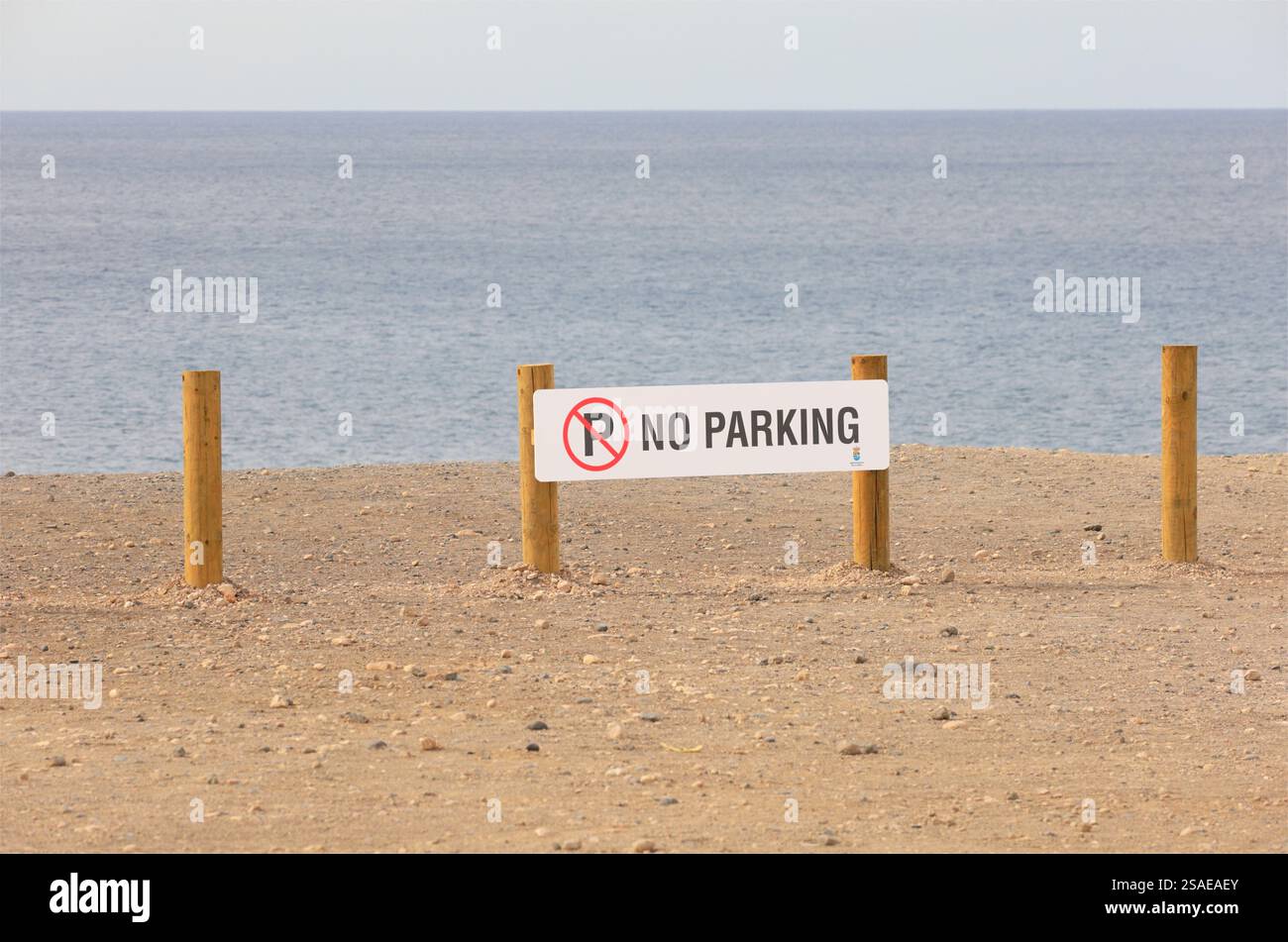 No Parking sign in English and wooden posts on a steep cliff edge, El ...