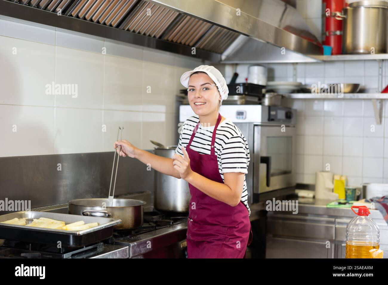 Production of semi-finished products - an female employee of a food ...