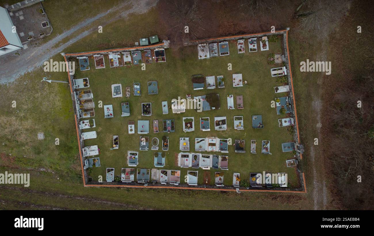 Above aerial view of graveyard. Visible graves in a orderly manner ...