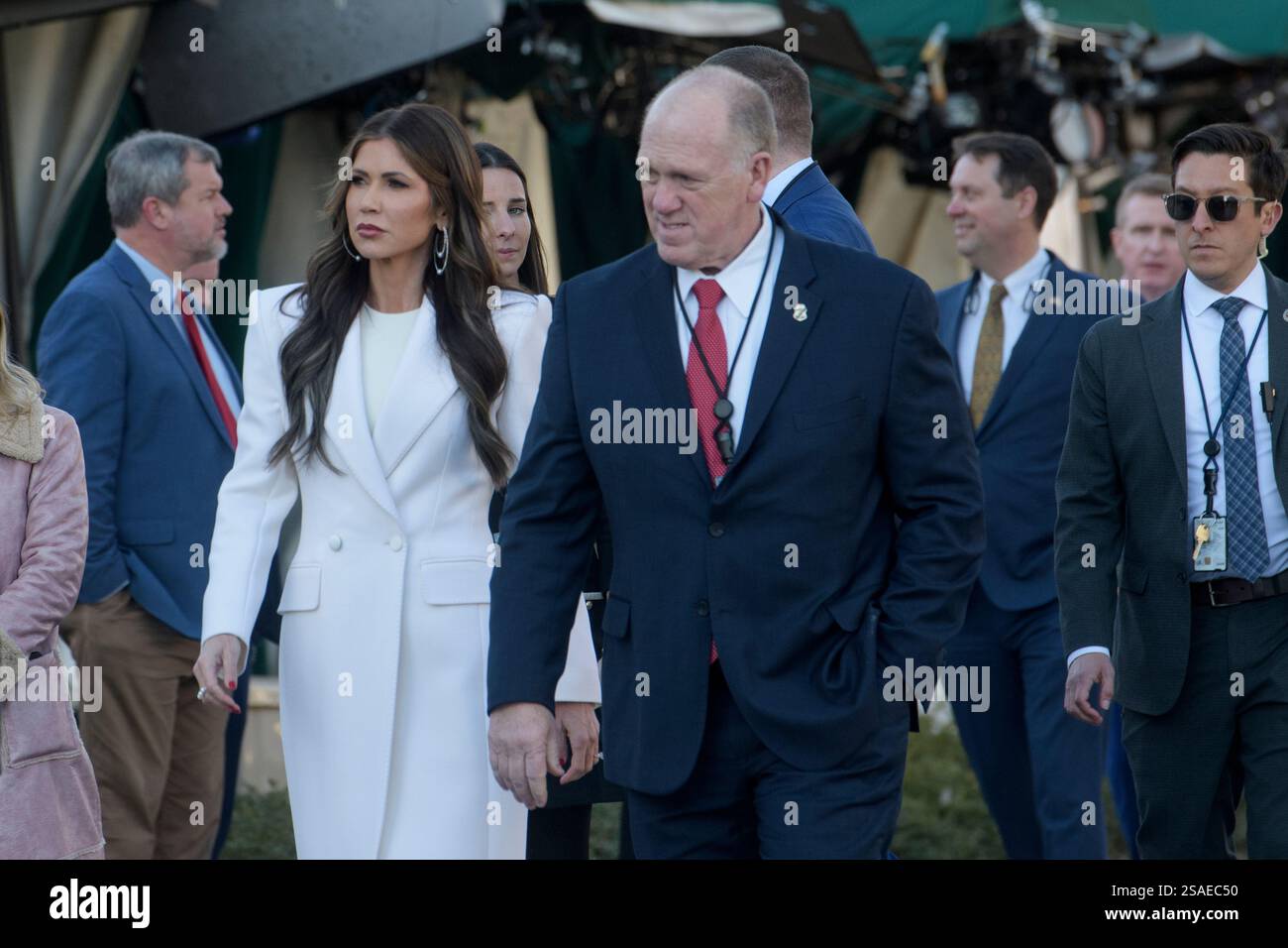Homeland Security Secretary Kristi Noem, left, and White House border czar Tom Homan walk at the ...