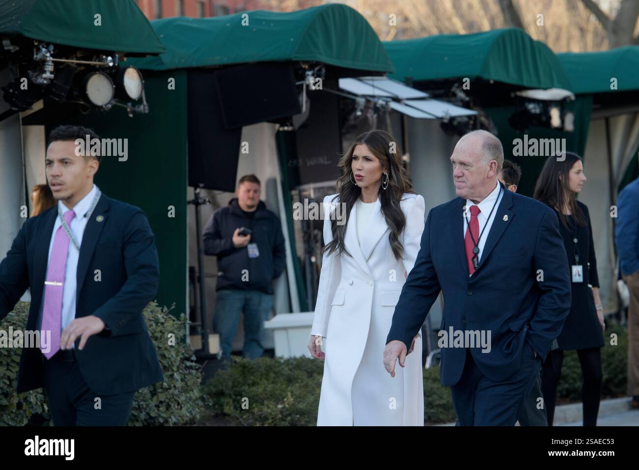 Homeland Security Secretary Kristi Noem, left, and White House border czar Tom Homan walk at the ...