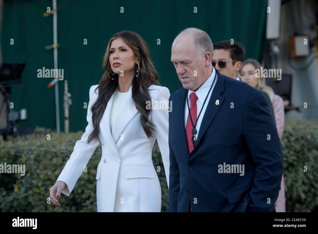 Homeland Security Secretary Kristi Noem, left, and White House border czar Tom Homan walk at the ...