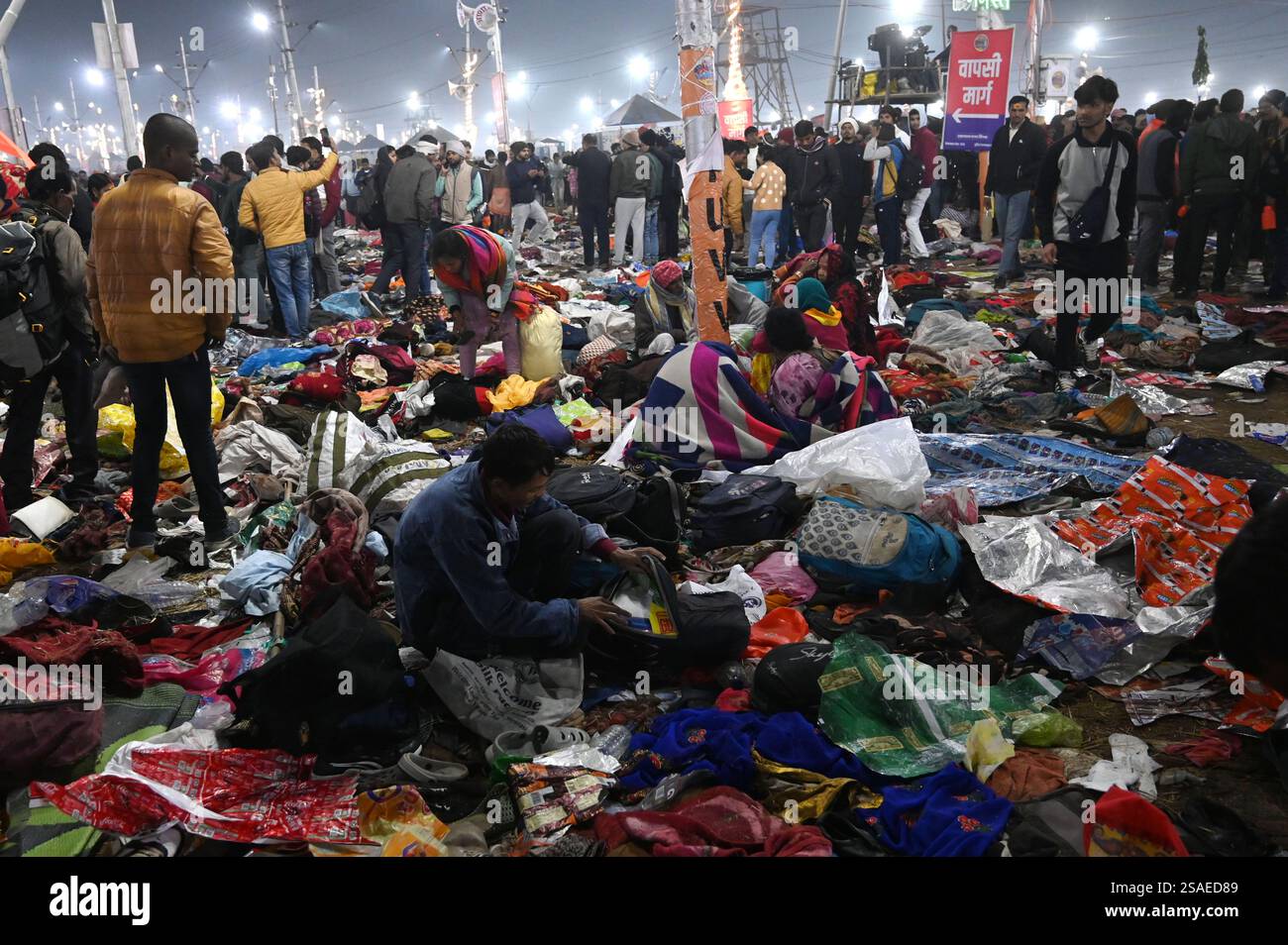 PRAYAGRAJ, INDIA - JANUARY 29: People walk after a deadly stampede ...