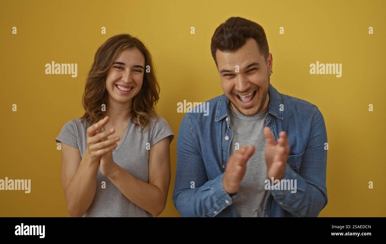 Woman clapping laughing over yellow hi-res stock photography and images ...