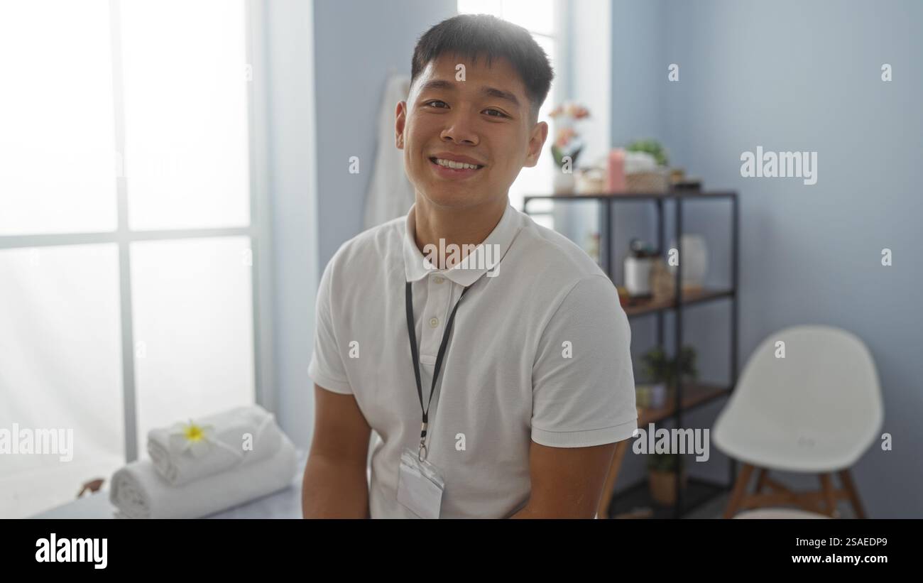 Smiling young man inside spa wellness center with modern interior ...