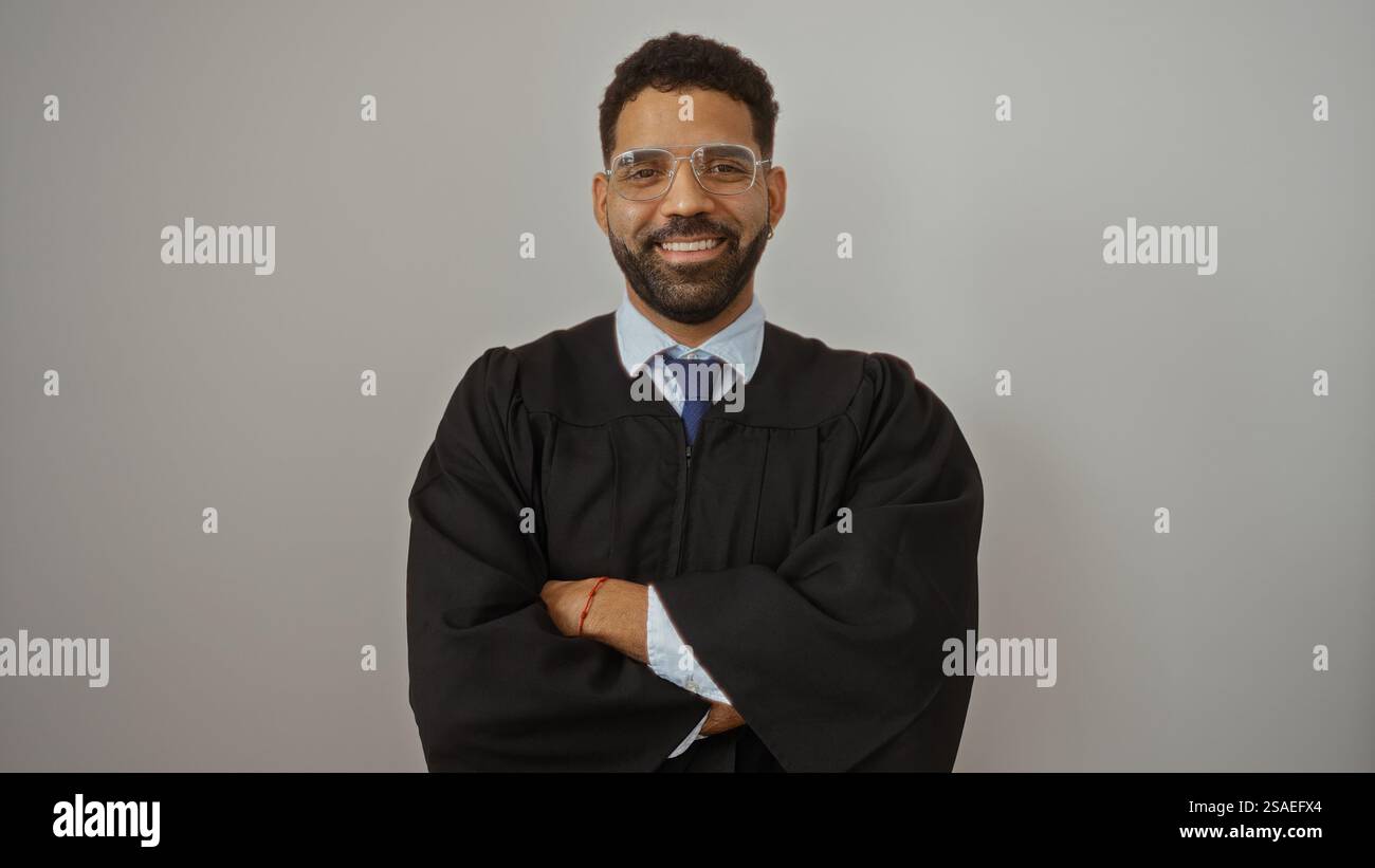 Handsome young man in a judge's robe with glasses smiling confidently ...