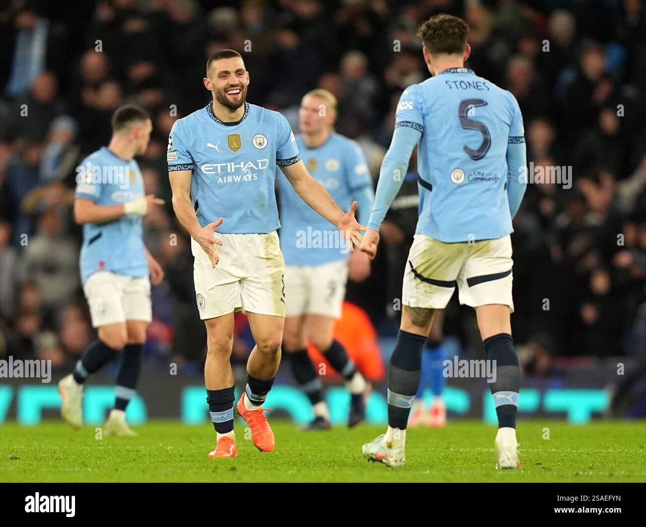 Manchester City's Mateo Kovacic (left) and team-mate John Stones ...