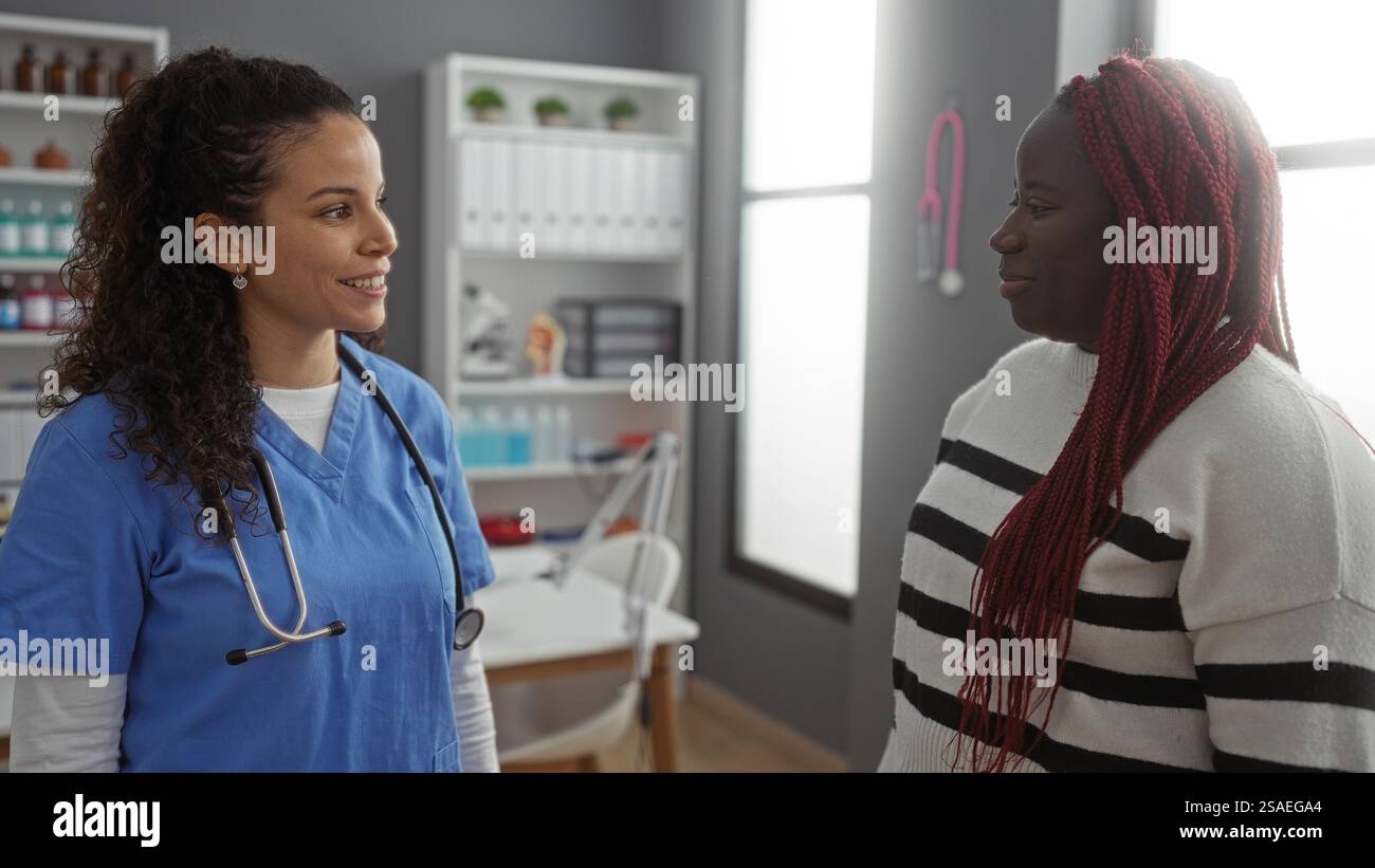 Nurse talking to a patient in a clinic setting, illustrating a positive ...