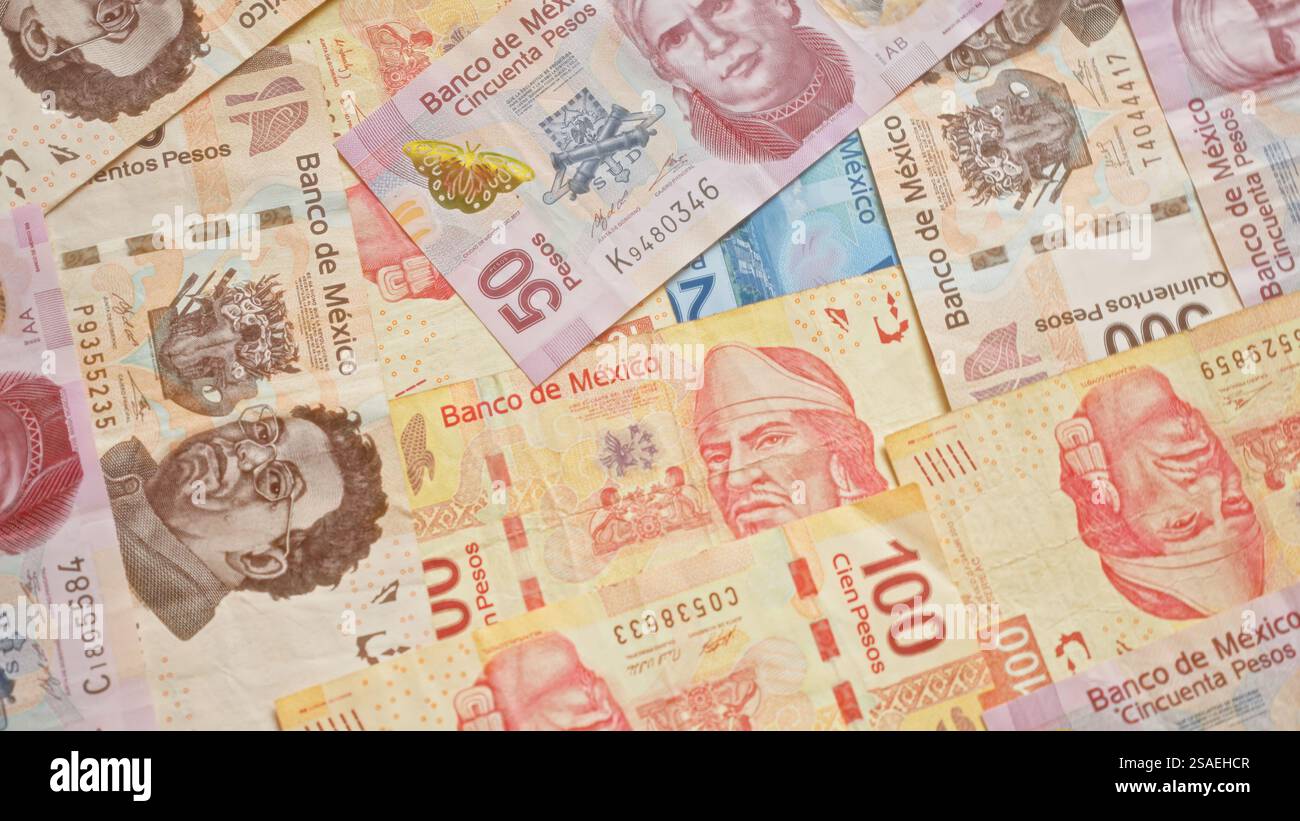 Mexican pesos banknotes scattered, showcasing various designs and ...