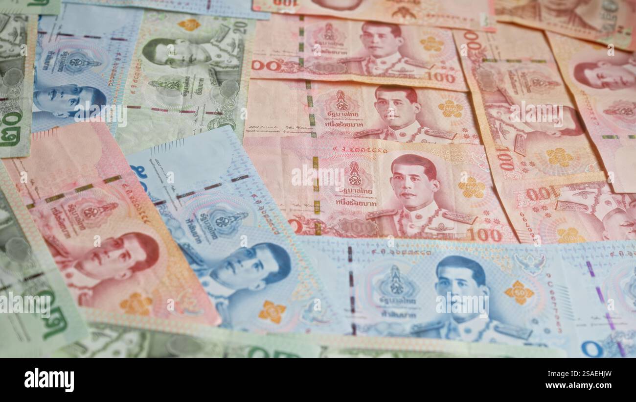 Colorful thai baht banknotes scattered showcasing thailand's currency ...