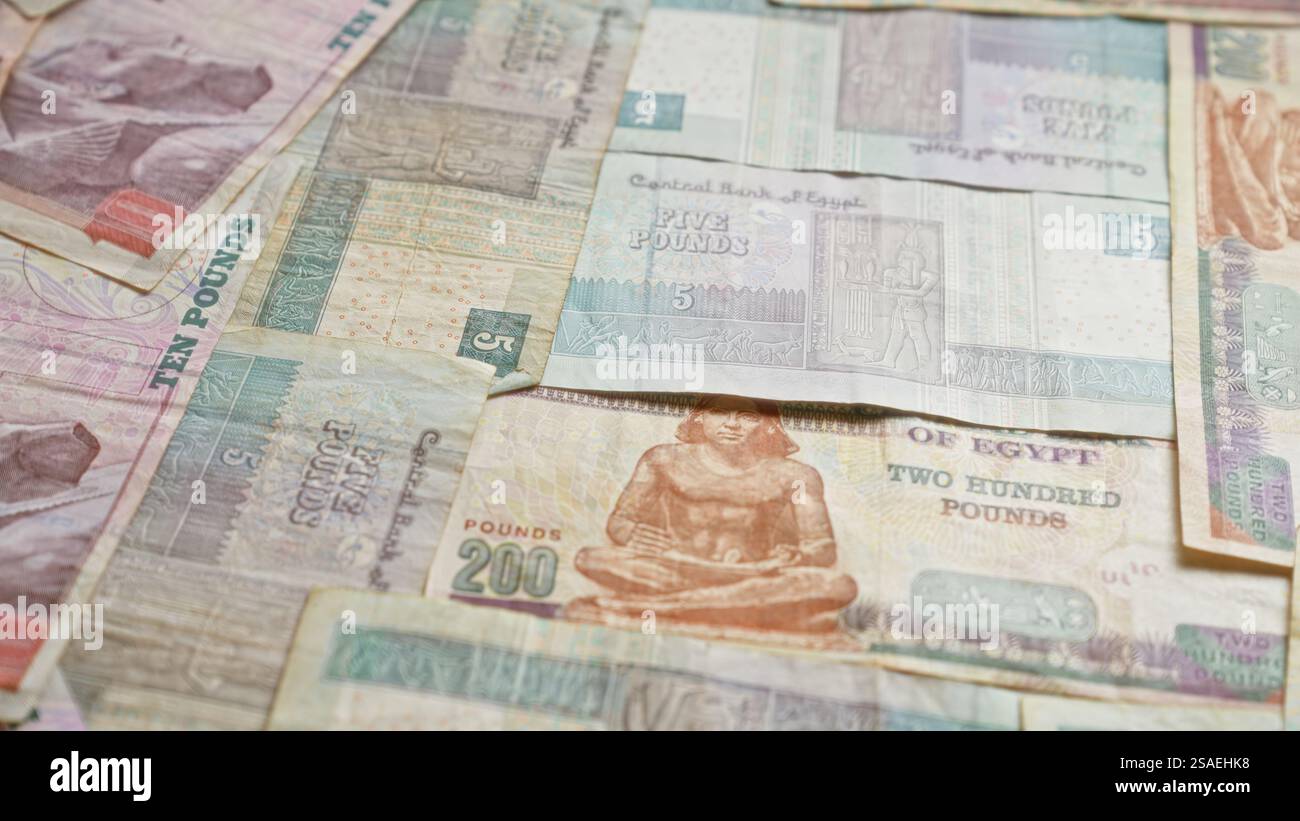 Egyptian banknotes in various denominations, including five, ten, and ...