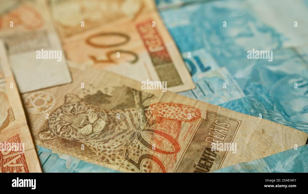 Closeup of colorful brazilian real banknotes on a table, showcasing the ...