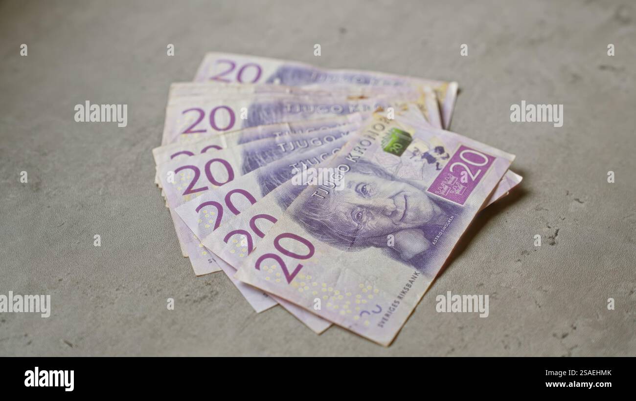 Swedish banknotes featuring the 20 krona denomination are fanned out on ...