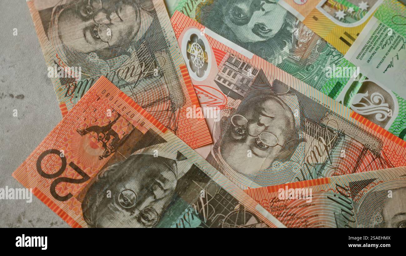 Australian banknotes scattered on a concrete surface depicting vibrant ...