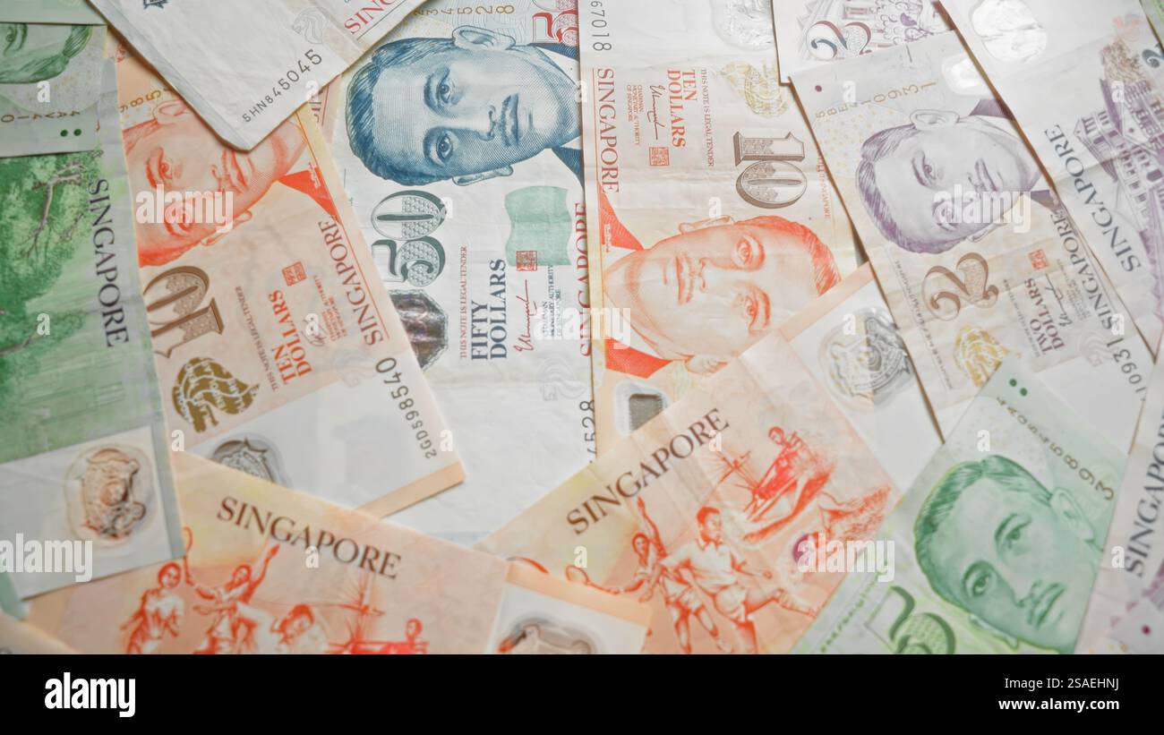 Multiple denominations of singapore dollars in various banknotes ...