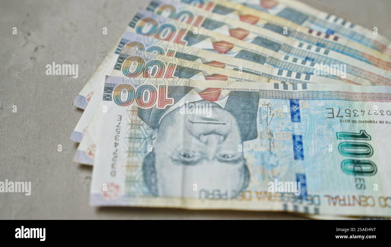 Peruvian banknotes on concrete surface showcasing soles currency in a ...