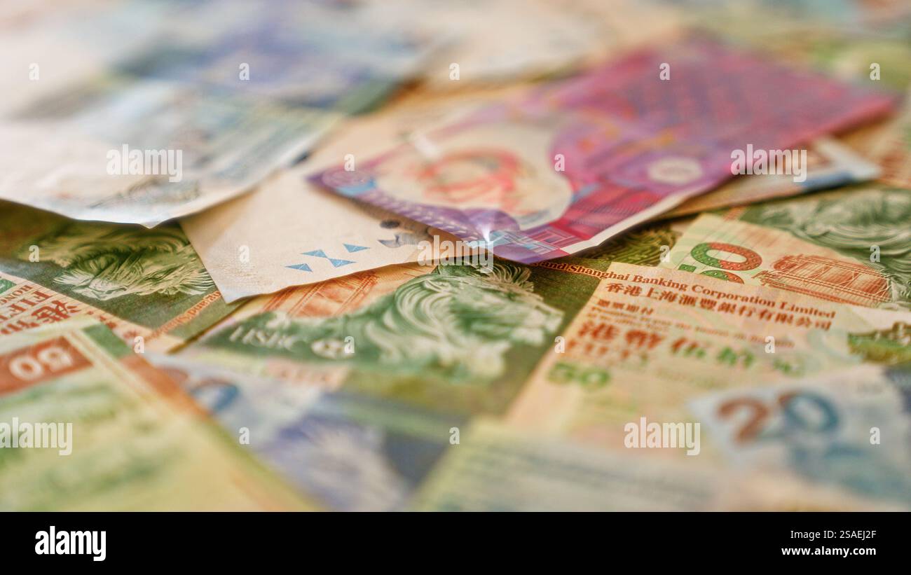 Hong kong dollar notes are scattered in a chaotic manner displaying ...