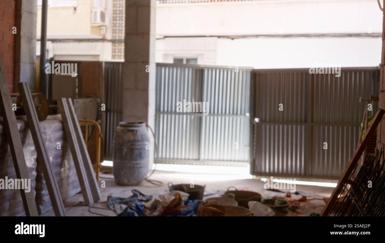 Blurred view of an unfinished building construction site with defocused ...