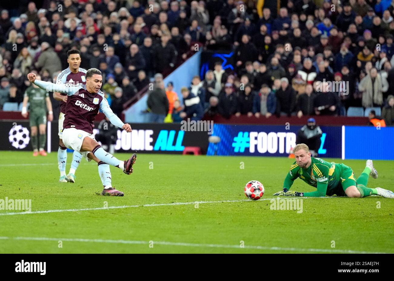 Aston Villa's Morgan Rogers (left) scores their side's fourth goal of ...