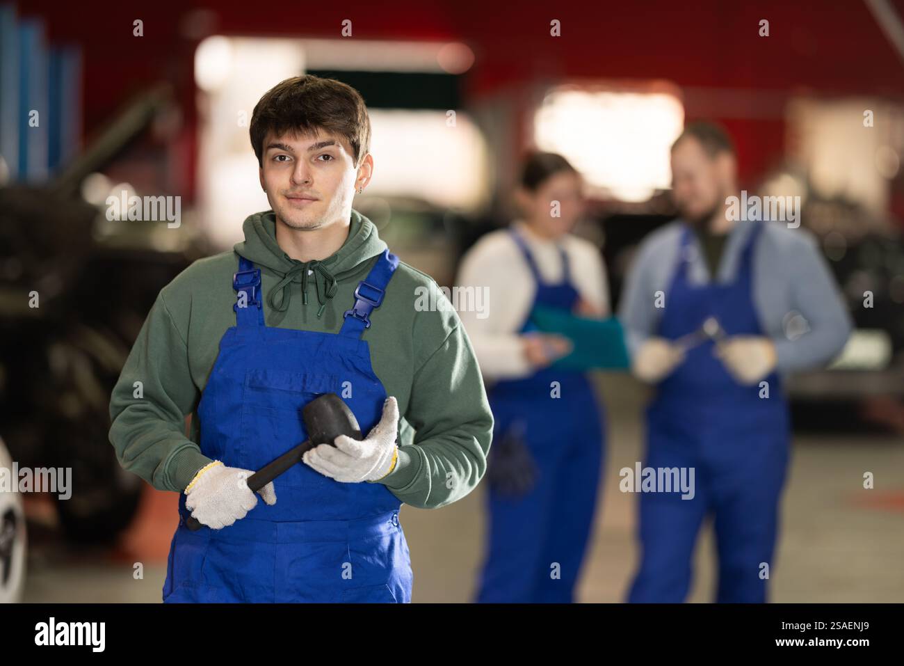 guy mechanic invites to a car service Stock Photo - Alamy