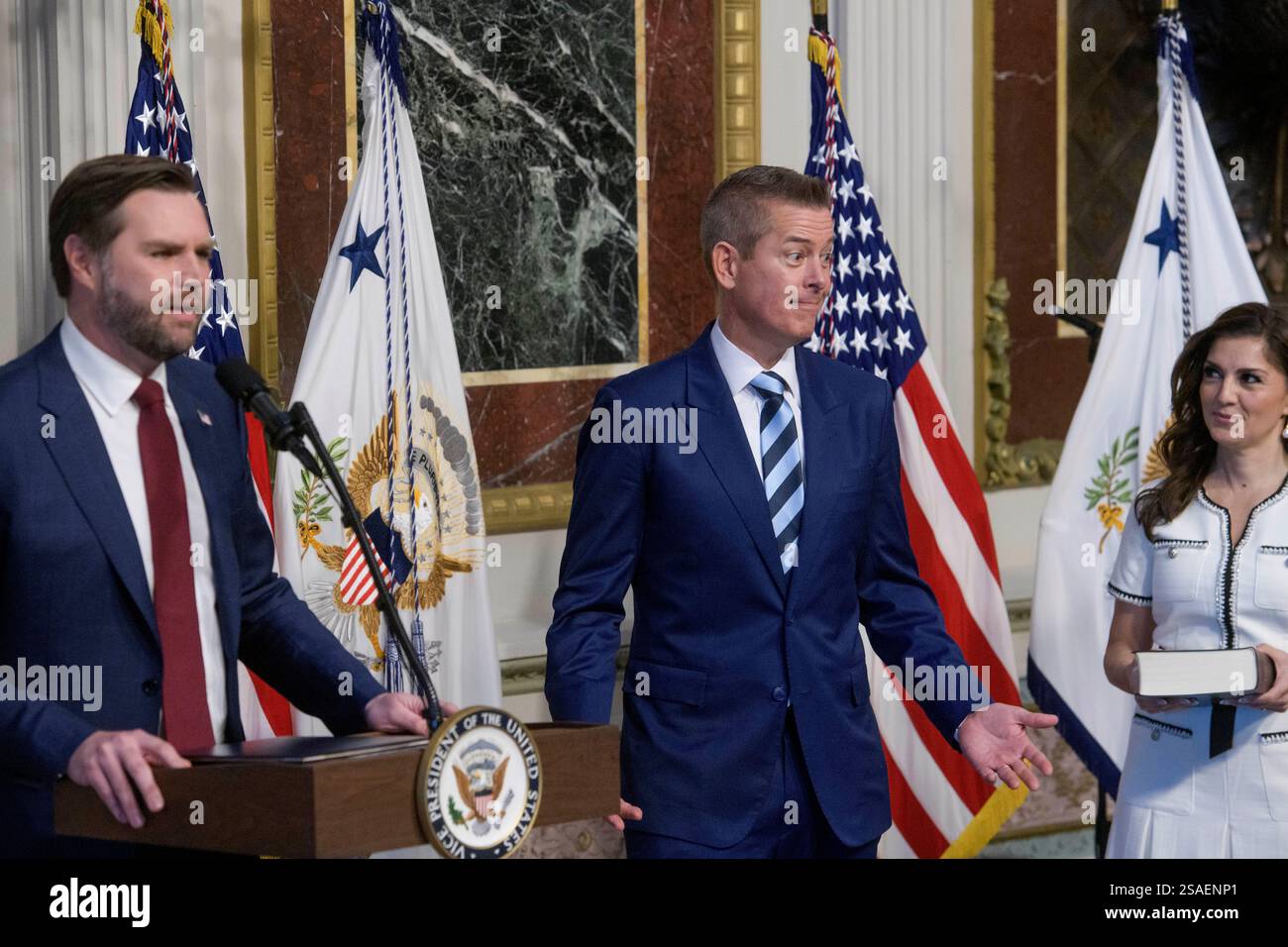 Vice President JD Vance, left, speaks before swearing in Sean Duffy ...
