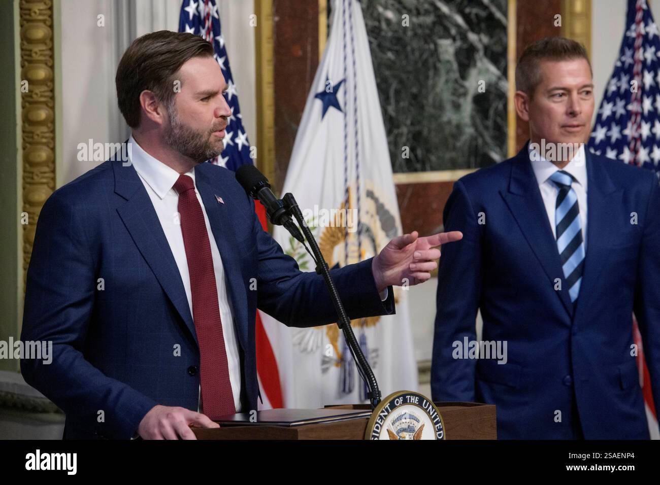 Vice President JD Vance, left, speaks before swearing in Sean Duffy ...