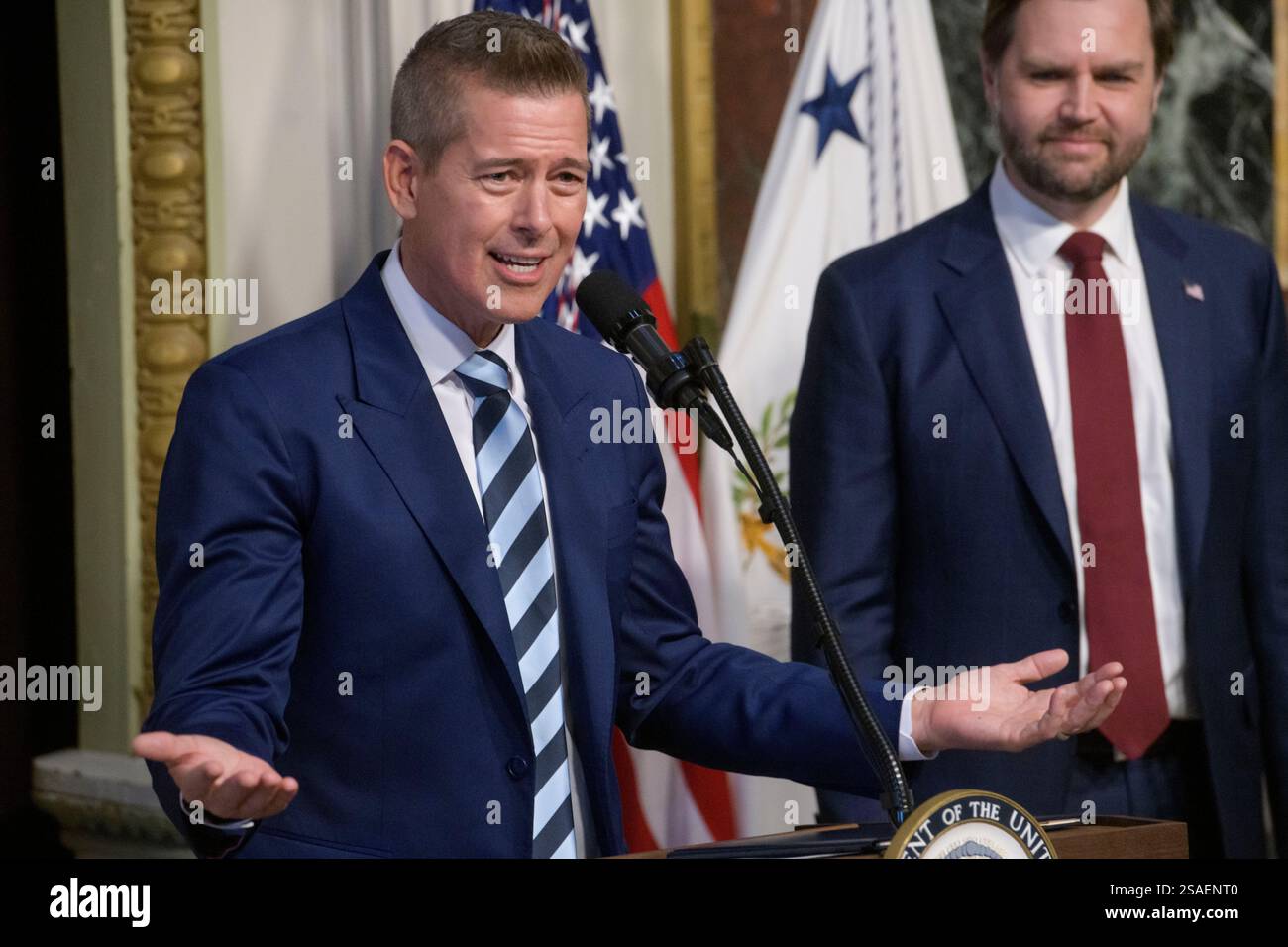 Transportation Secretary Sean Duffy, left, speaks after being sworn in ...