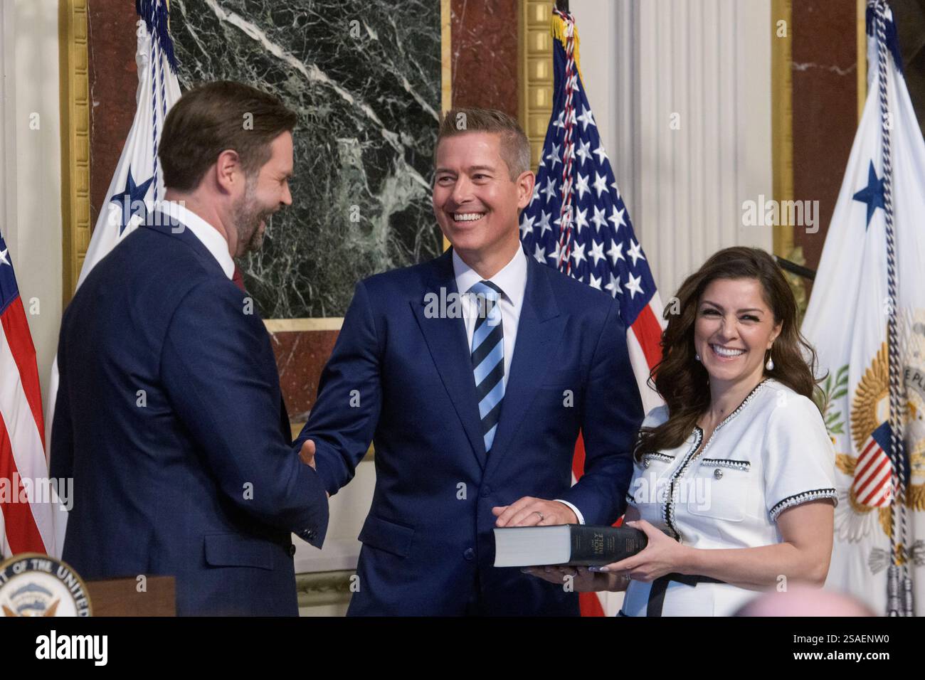 Vice President JD Vance, left, shakes hands with Sean Duffy after ...