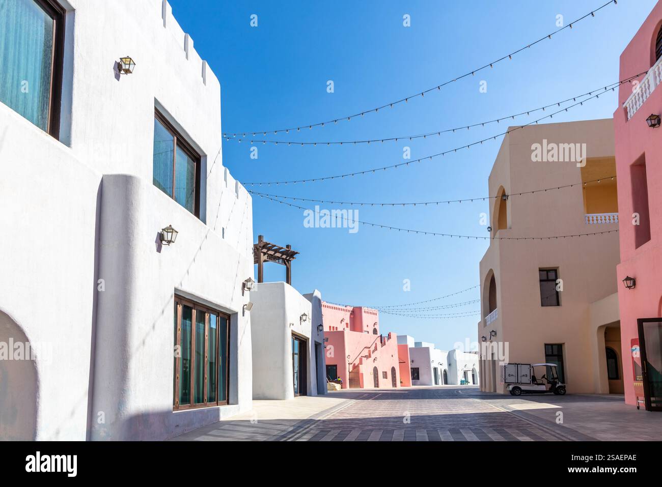 Colorful Mina village district street with arab traditional shaped ...