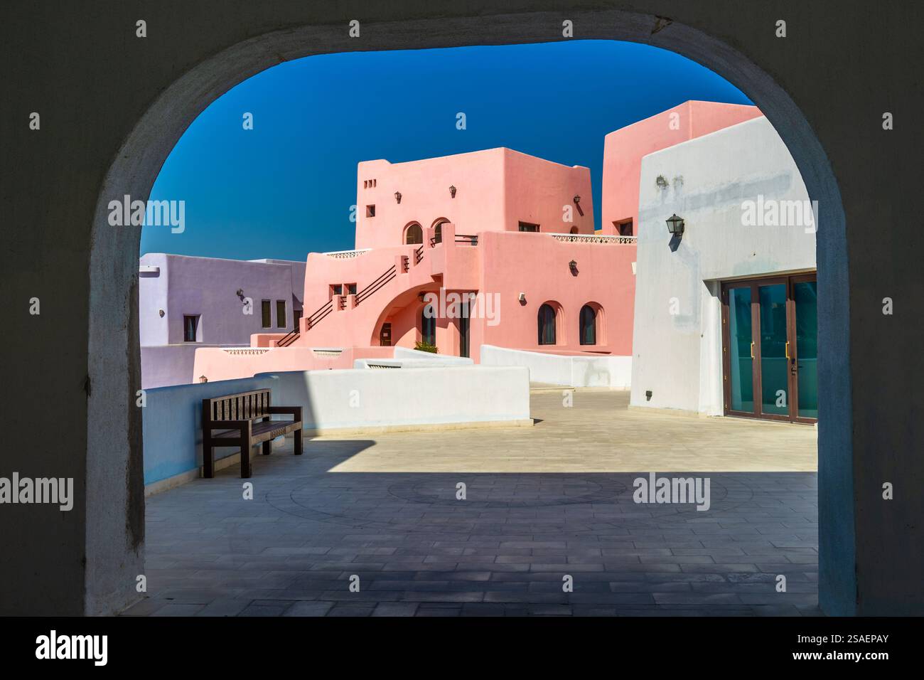 Colorful Mina village district street with arch and arab traditional ...