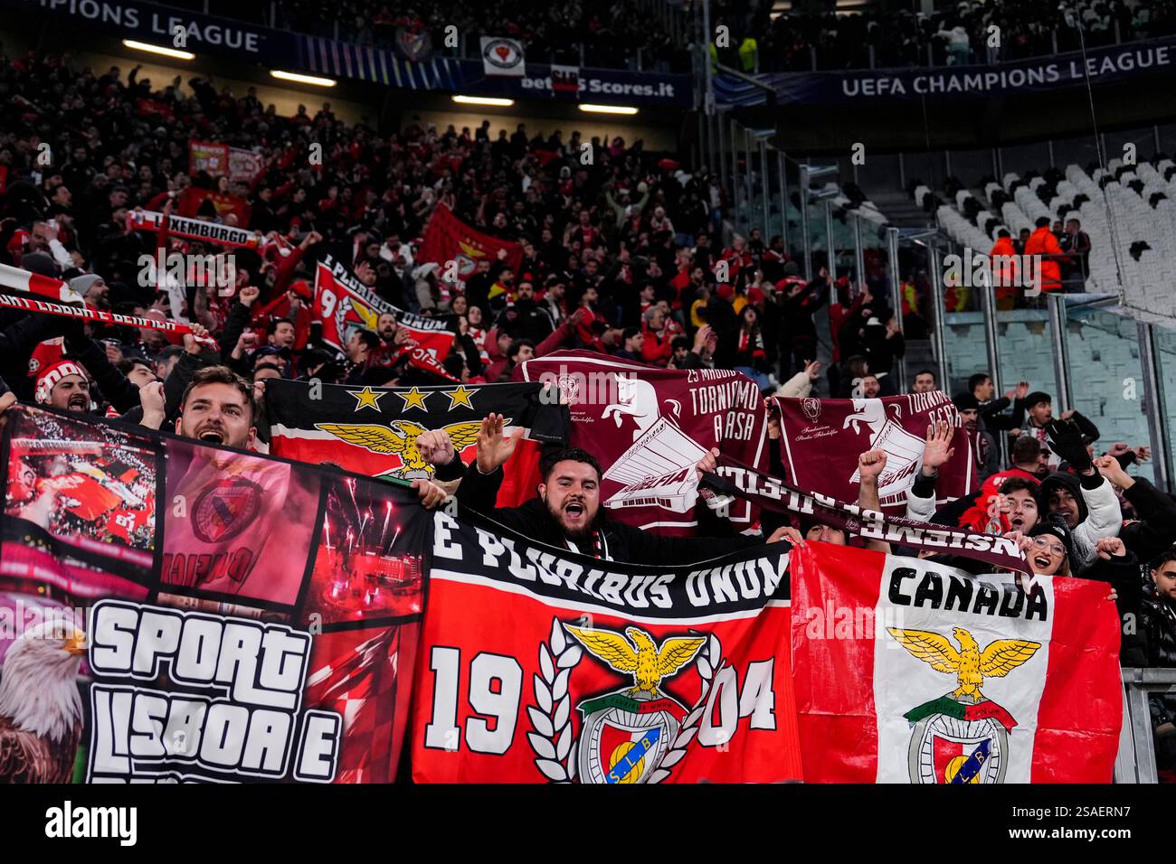 Torino, Italia. 30th Jan, 2025. Benfica's fan with the Torino Fc flag ...