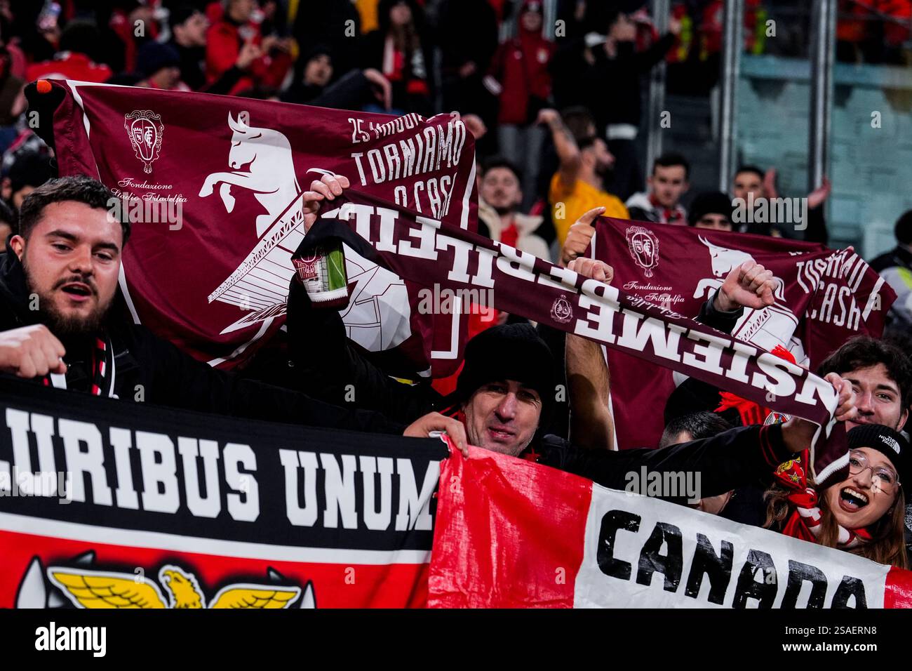 Torino, Italia. 30th Jan, 2025. Benfica's fan with the Torino Fc flag ...