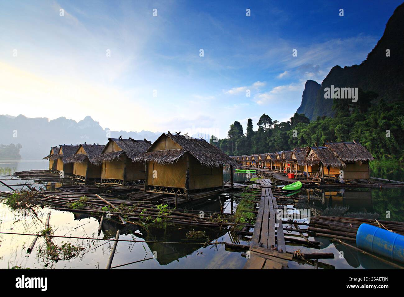 Floating raft house reflection on water in Khao Sok National Park Surat ...