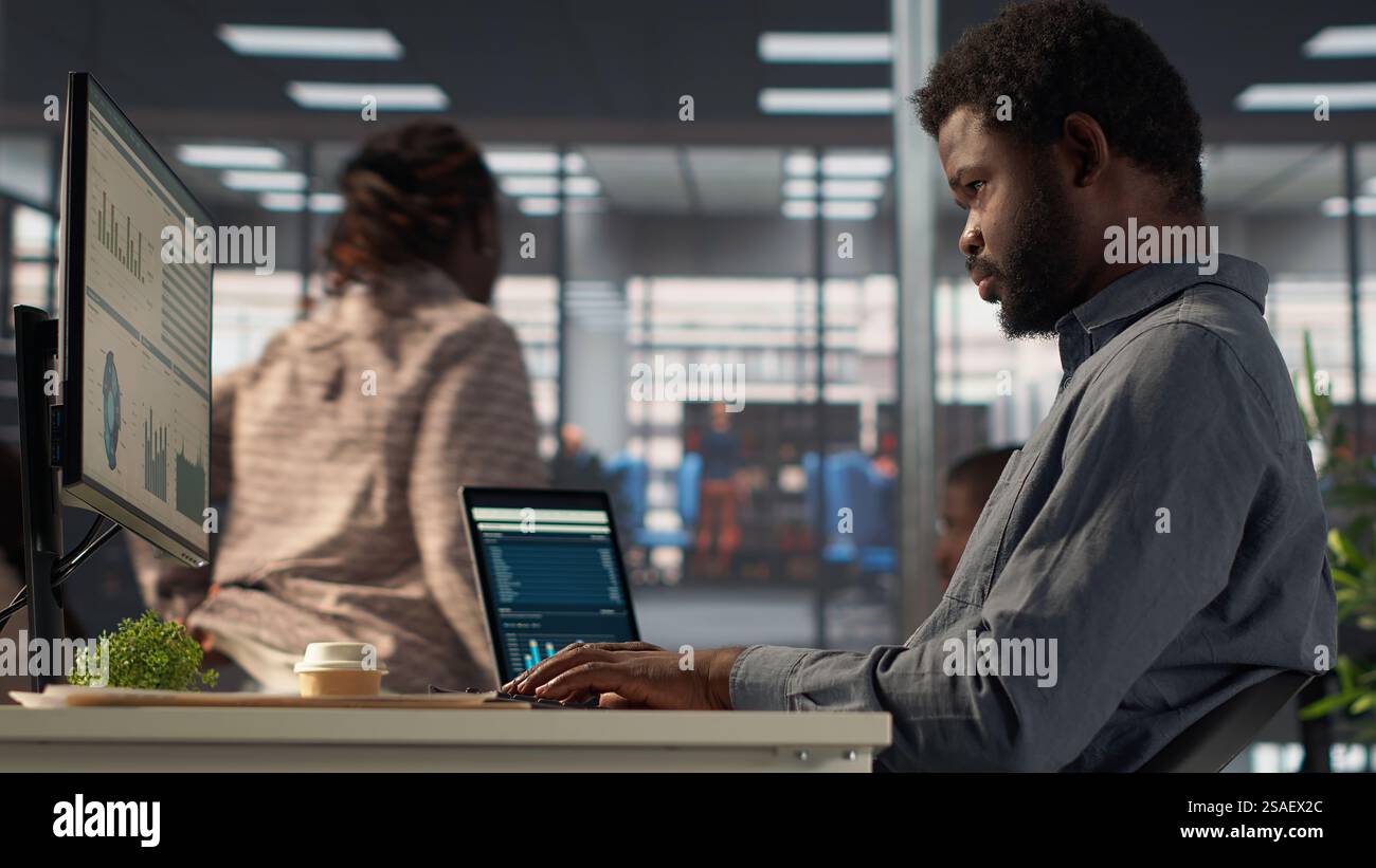 Analyst studying infographics and performance metrics for decision ...