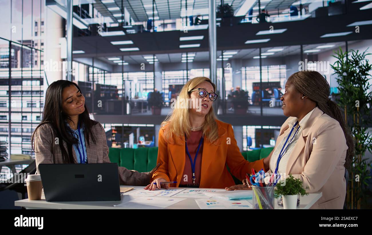 Businesswomen consoling their female boss after hearing bad news ...