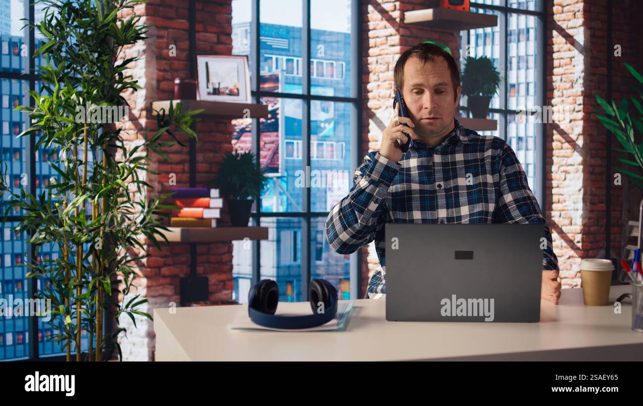 Manager at work arguing with employee during phone call after finding mistakes in spreadsheets ...